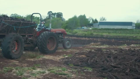 Tractor and trailer loaded with turf dri... | Stock Video | Pond5