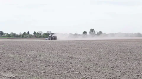 Tractor plowing the black earth plow fie... | Stock Video | Pond5