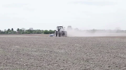 Plowing Earth Tractor Stock Footage ~ Royalty Free Stock Videos | Pond5