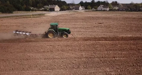tractor plowing field top view, aerial p... | Stock Video | Pond5