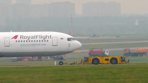 Tractor pull aircraft Royal Flight | Stock Video | Pond5