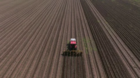 Tractor pulling Fertilizer discharge arm... | Stock Video | Pond5