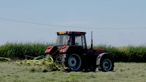 tractor threshing hay on a farm in the e... | Stock Video | Pond5