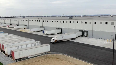 Tractor trailer backs up to distribution... | Stock Video | Pond5