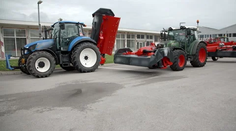 Tractors of different colours and sizes | Stock Video | Pond5