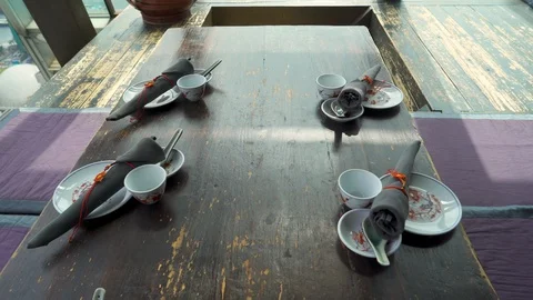 A traditional Asian table setting in a r... | Stock Video | Pond5