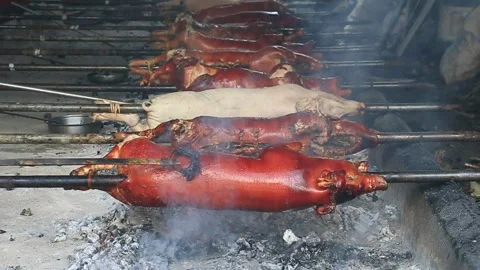 Traditional cooking of lechon pork delic... | Stock Video | Pond5