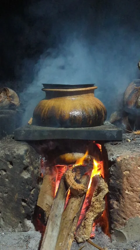 traditional cooking pot under heat in a ... | Stock Video | Pond5