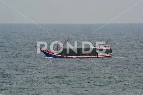 Traditional Southeast Asian Fishing Boat on Calm Open Sea Stock Image ...