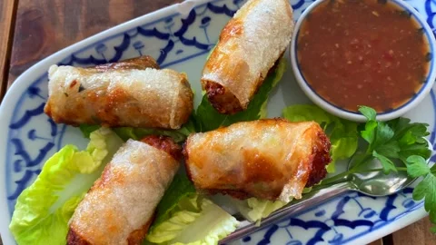 Traditional spring rolls on lettuce with... | Stock Video | Pond5