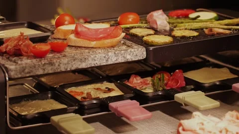 Traditional Swiss melted raclette cheese... | Stock Video | Pond5