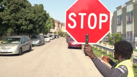 Traffic control with stop slow sign acco... | Stock Video | Pond5