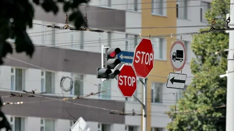 Traffic light and road signs on the back... | Stock Video | Pond5