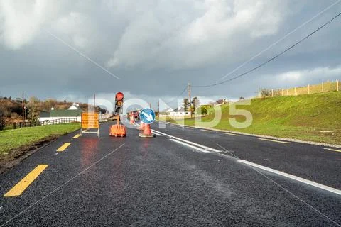 Photograph: Traffic light counting down at road construction site ...
