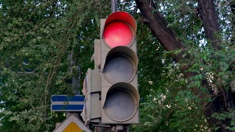A traffic light shows a red signal, indi... | Stock Video | Pond5