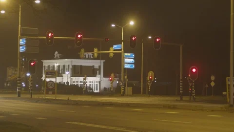 Traffic lights turning green at urban in... | Stock Video | Pond5