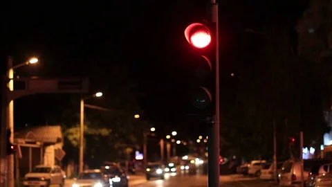Traffic at night stopping at a stop ligh... | Stock Video | Pond5