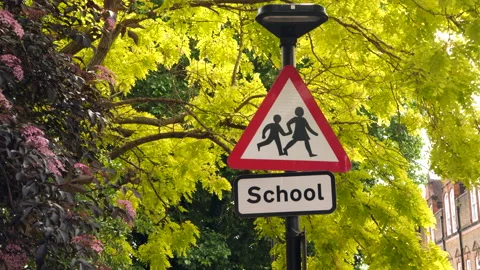 Traffic sign indicating school area on a... | Stock Video | Pond5
