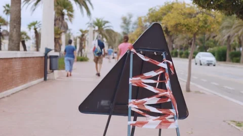Traffic sign with red and white ribbon i... | Stock Video | Pond5