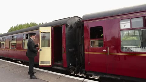 Train conductor closing door of steam tr... | Stock Video | Pond5