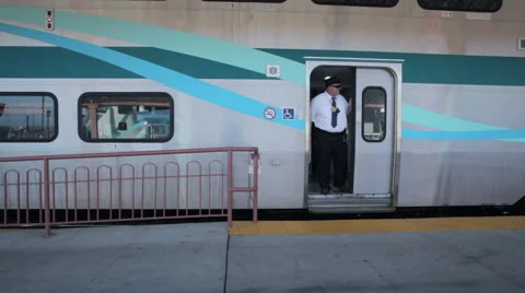 Train conductor standing in open doors i... | Stock Video | Pond5