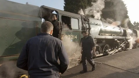 Train crew board a vintage steam engine ... | Stock Video | Pond5