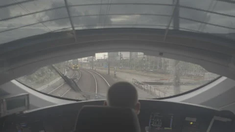 Train driver in control cabin of high sp... | Stock Video | Pond5