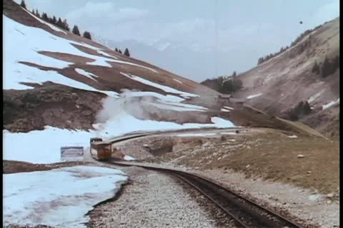Train driving on railroad track through ... | Stock Video | Pond5