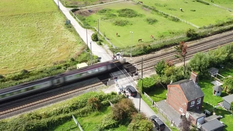 Train passing a crossing with people wai... | Stock Video | Pond5