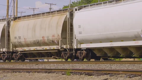 a train pulling white hopper cars rollin... | Stock Video | Pond5
