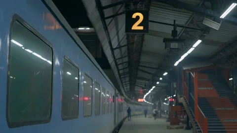 Train standing on Empty railway platform... | Stock Video | Pond5