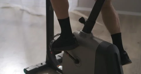 training on exercise bicycle,rear view a... | Stock Video | Pond5