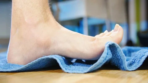 Training flat feet toes grabbing towel o... | Stock Video | Pond5