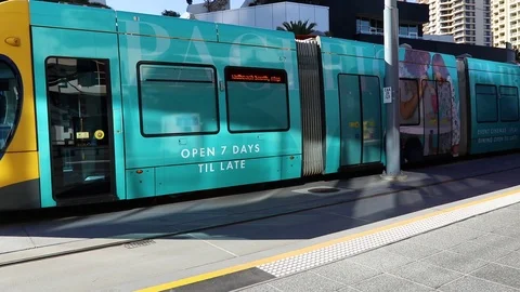 Tram arriving at tram station stop with ... | Stock Video | Pond5