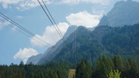 Tram cable car lines swoop over tree top... | Stock Video | Pond5