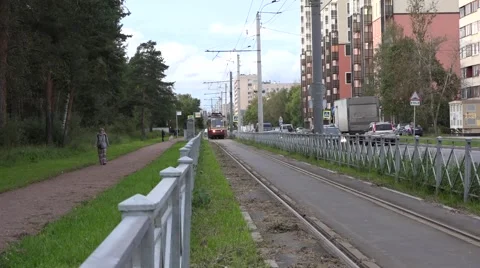 Tram runs along single-track fenced segr... | Stock Video | Pond5