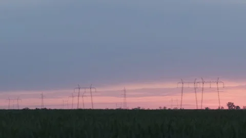 Transmission line at sunset. Sky in back... | Stock Video | Pond5