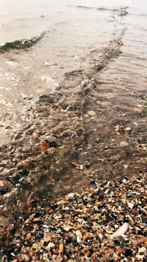 Transparent sea water splashes on shore ... | Stock Video | Pond5