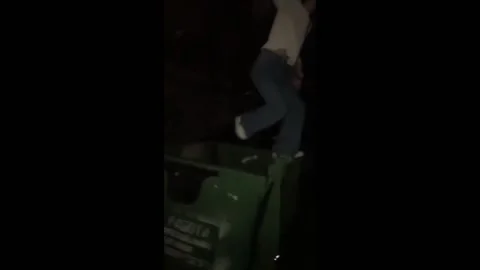 Trash can fail: girl takes a tumble whil... | Stock Video | Pond5