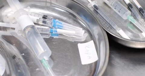 Trays with medicine in syringes stand in... | Stock Video | Pond5