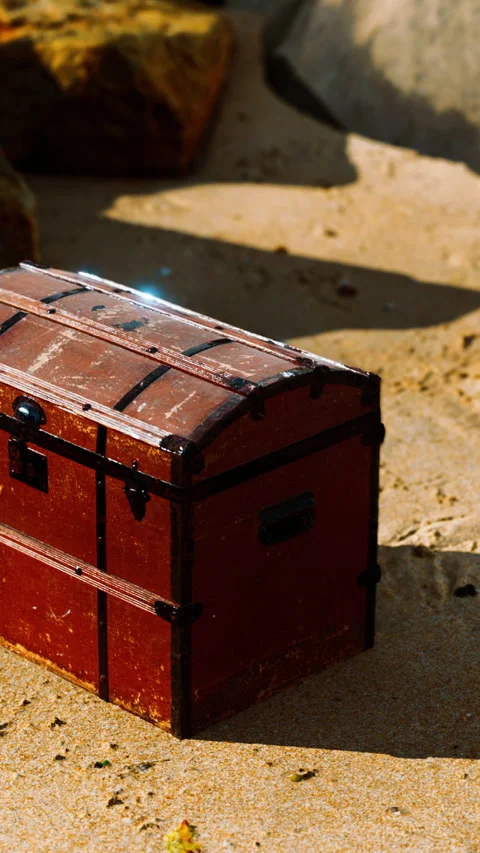 treasure chest in sand dunes on a beach | Stock Video | Pond5