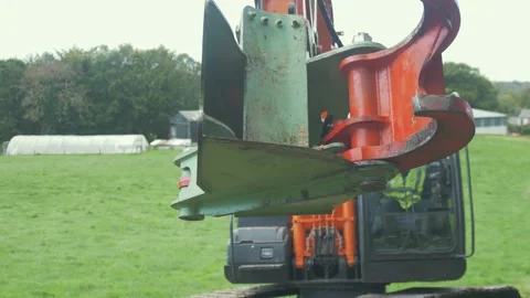 Tree shears on digger excavator lifting ... | Stock Video | Pond5