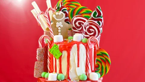 On trend candyland Christmas drip cake | Stock Video | Pond5