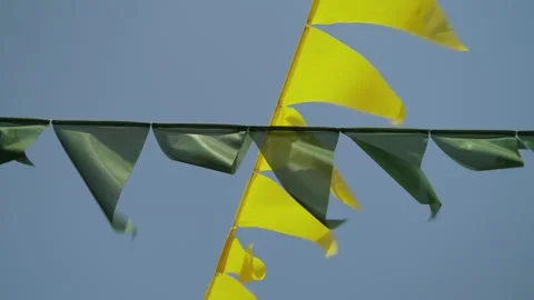 Triangular flags hang on a rope at the f... | Stock Video | Pond5
