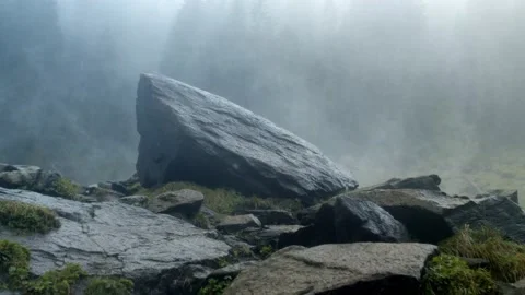 Triangular shaped rock next to waterfall... | Stock Video | Pond5