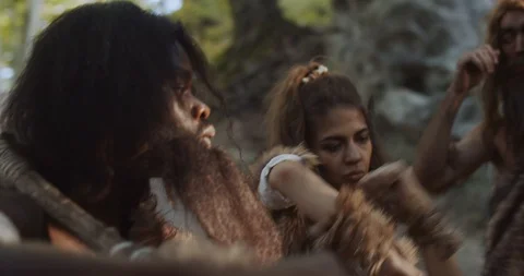 Tribe of cavemen neanderthals wearing an... | Stock Video | Pond5