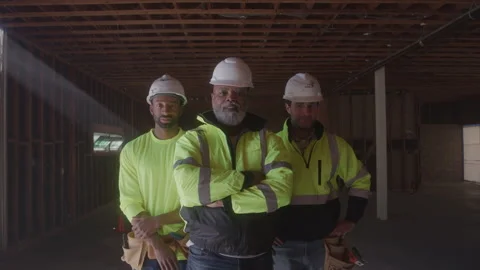 Trio Of Construction Workers Stand Toget... | Stock Video | Pond5