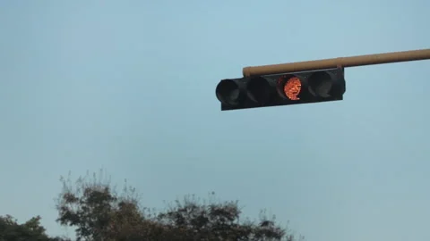 Tripod shot of traffic light turning red... | Stock Video | Pond5