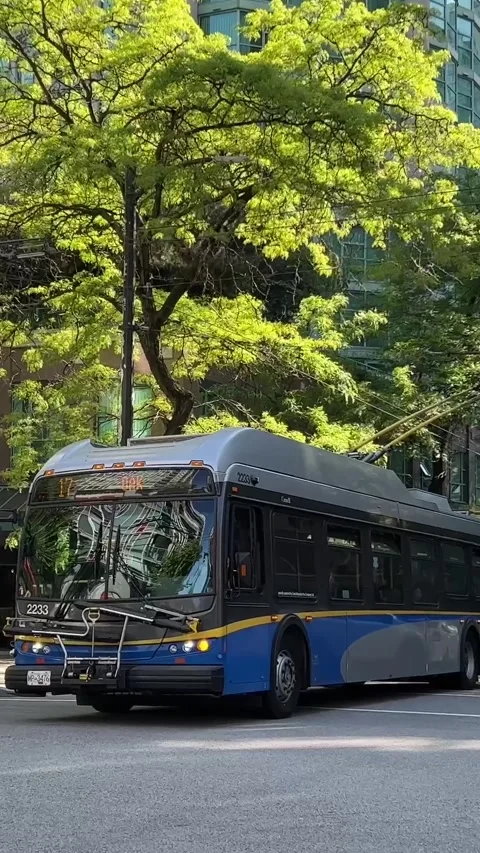 trolley bus in Vancouver city people run... | Stock Video | Pond5