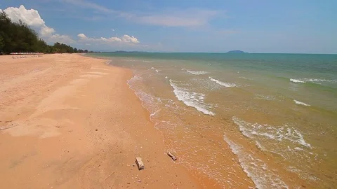 tropical beach on blue sky background | Stock Video | Pond5